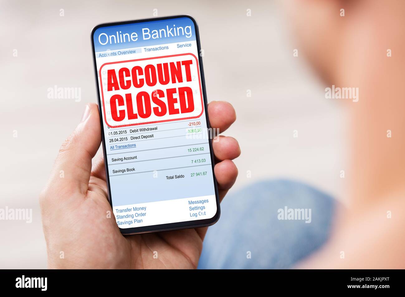 Person's Hand Holding Mobile Phone With Online Banking Application And ...