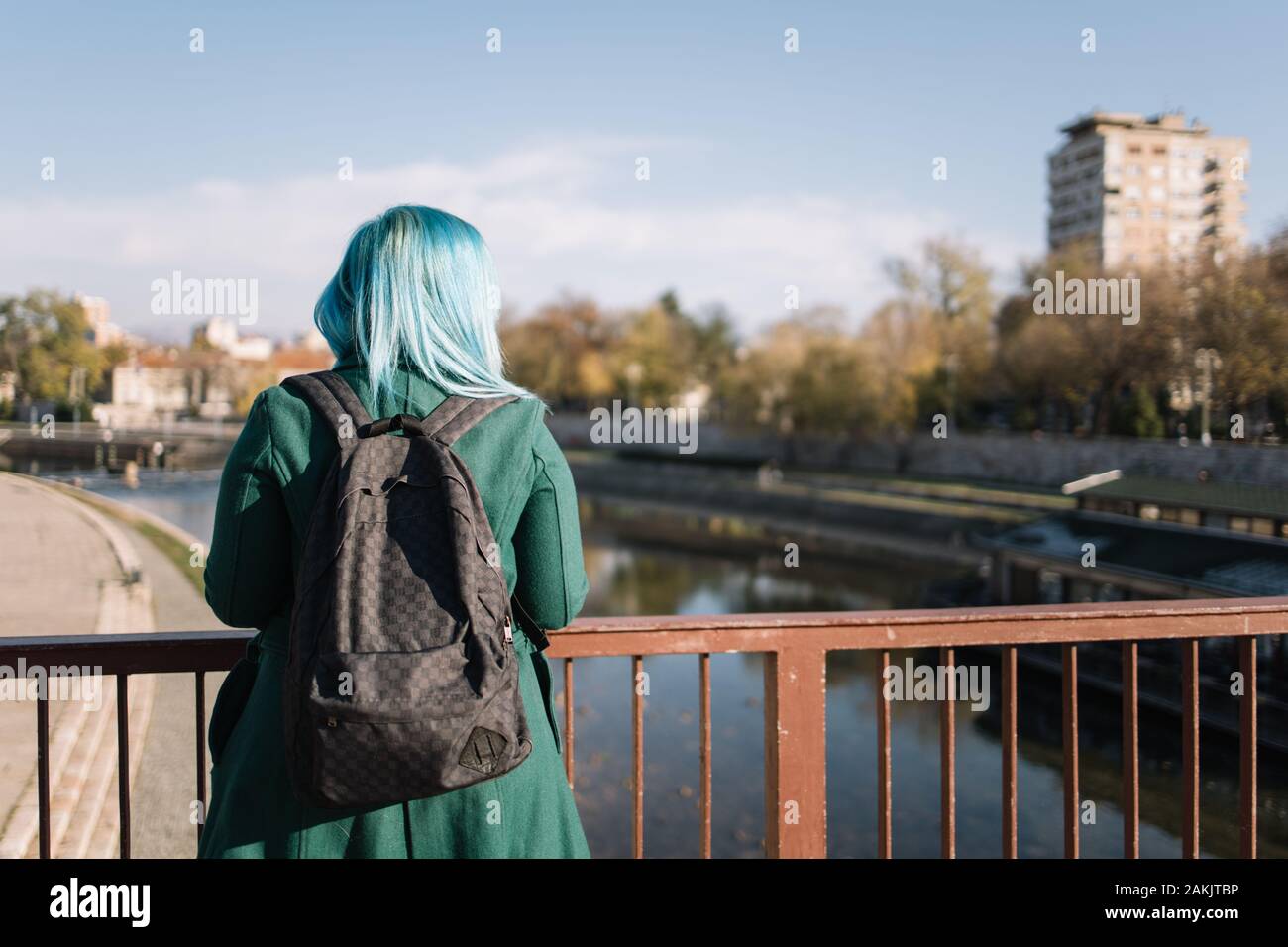 Back view of girl pointing with right hand Stock Photo - Alamy