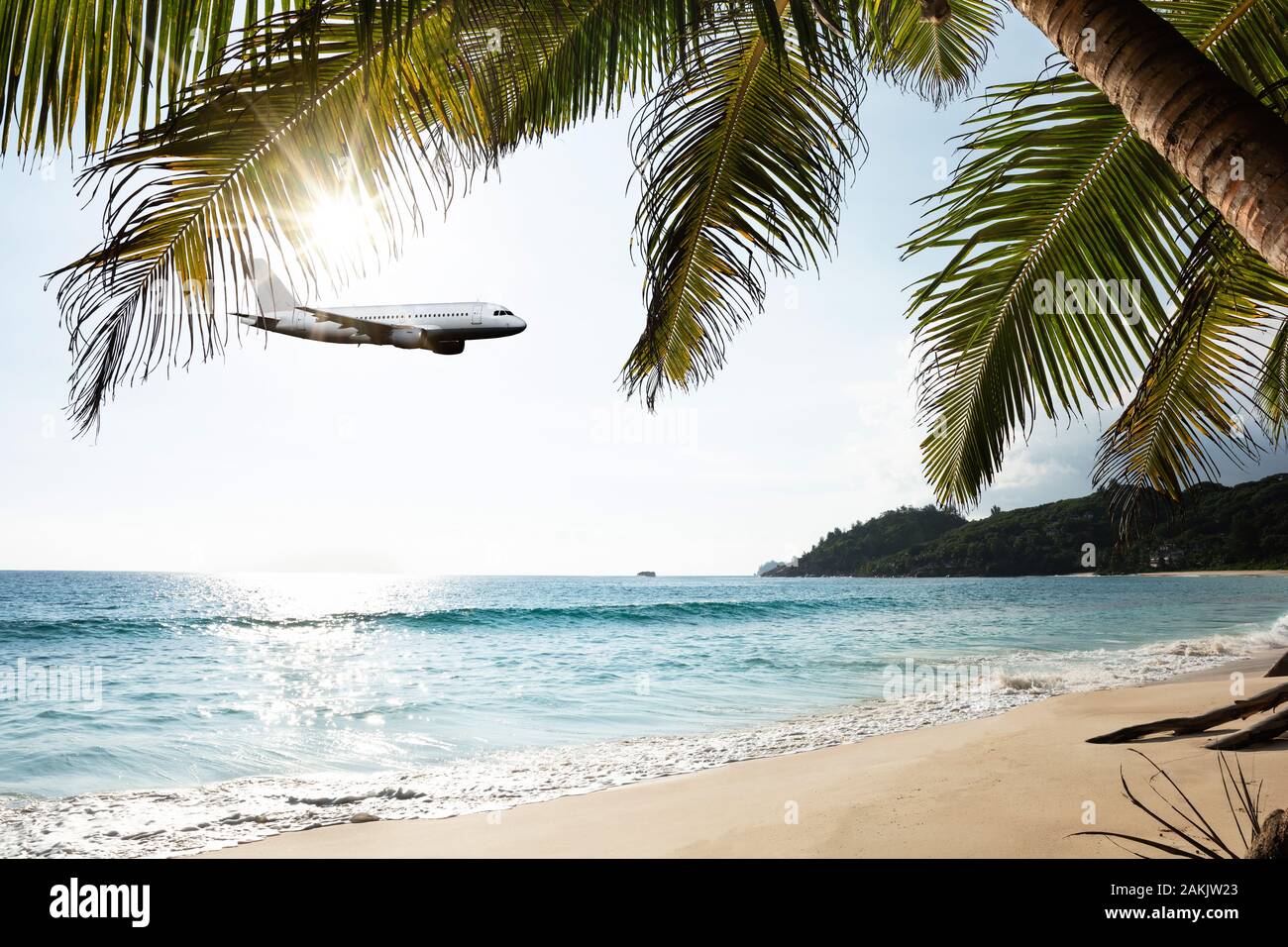 Wing of aeroplane over ocean island hi-res stock photography and images ...