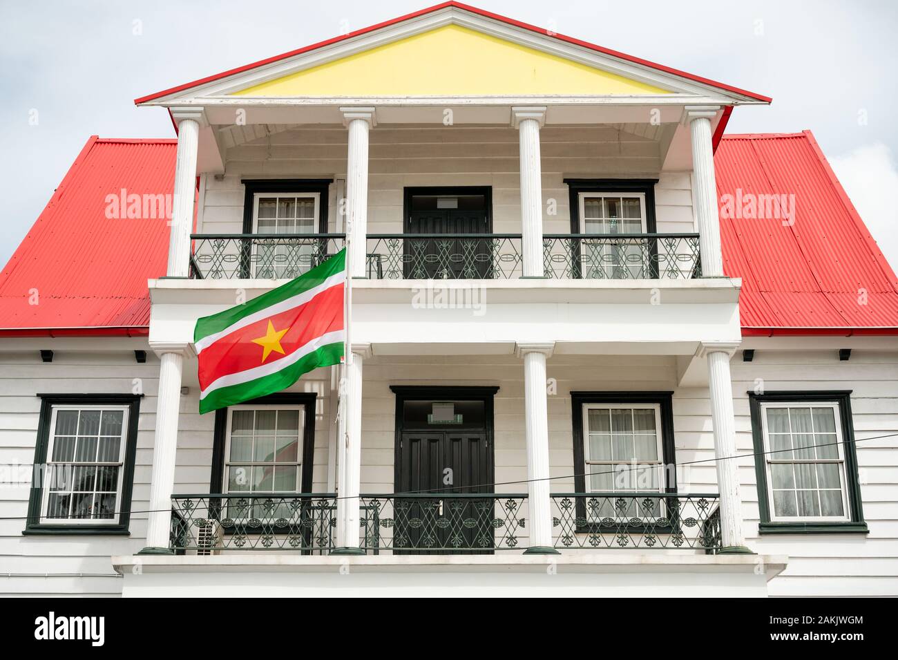 National flag of Suriname flying outside a building on Canal Street in ...