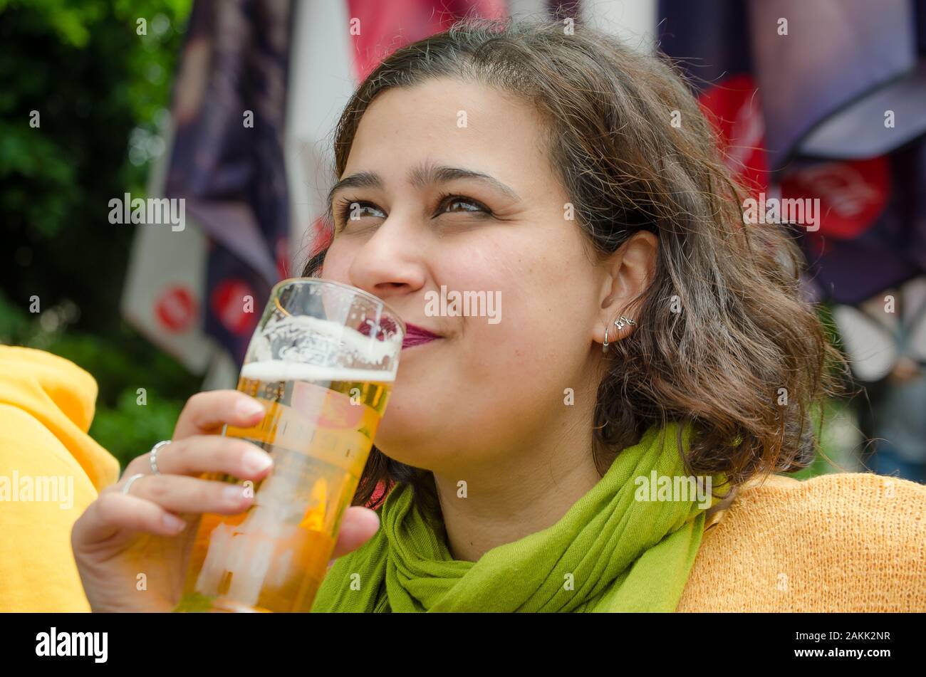 Young white woman drinking a beer Stock Photo - Alamy