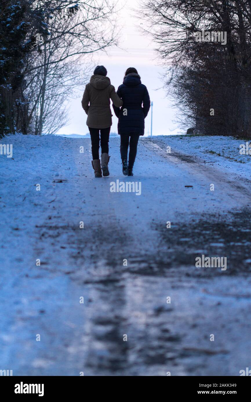 Two people walking hi-res stock photography and images - Alamy