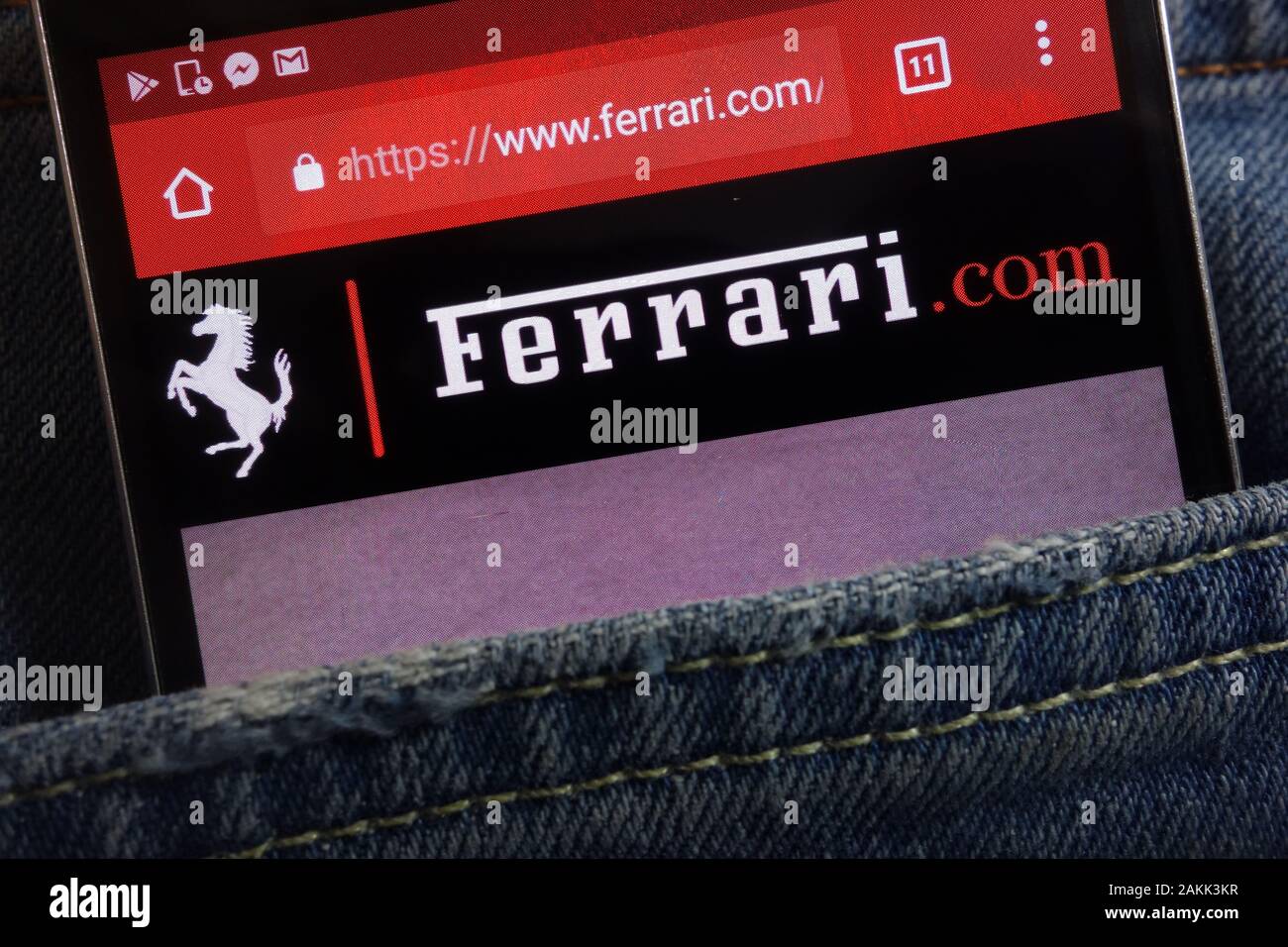 Ferrari website displayed on smartphone hidden in jeans pocket Stock ...