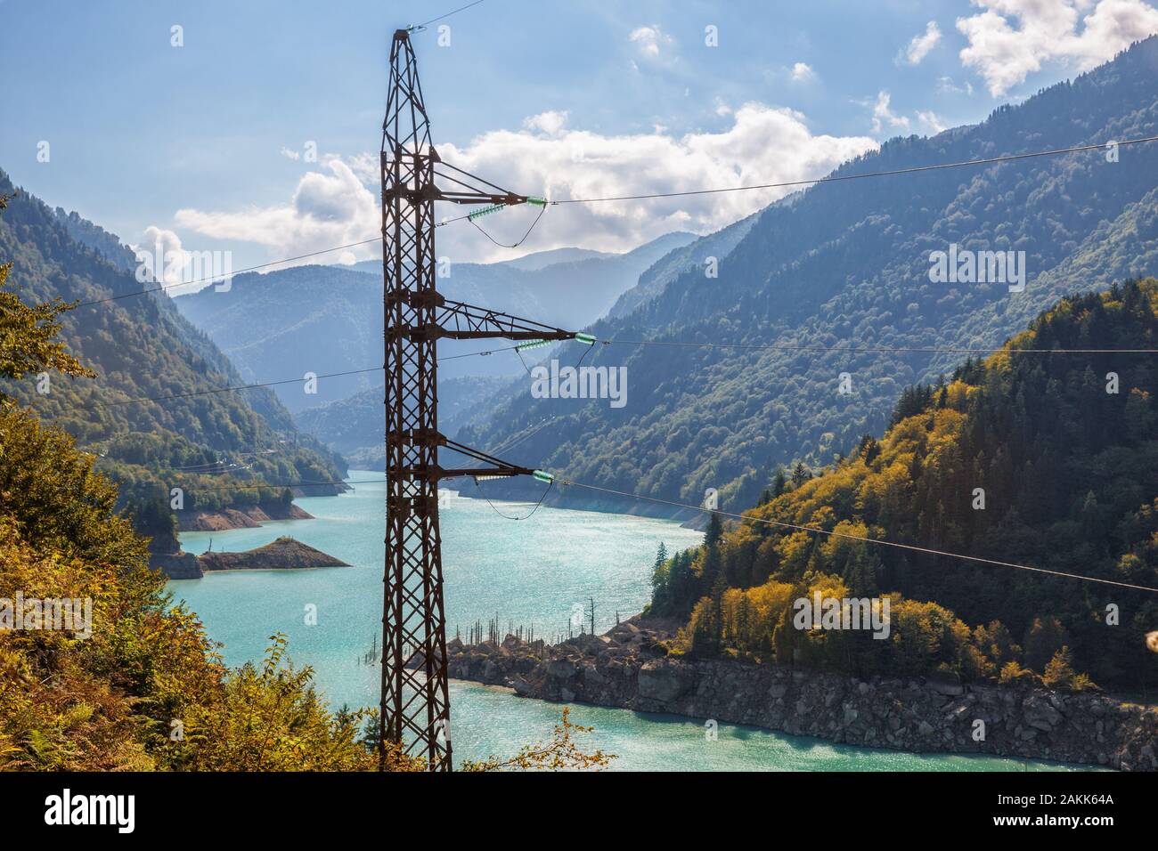High voltage tower in mountains of Caucasus. Hydropower, transmission ...