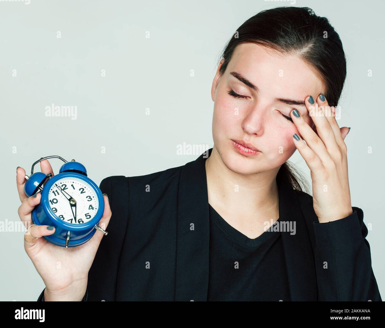 young beauty woman in business style costume waking up for work early ...