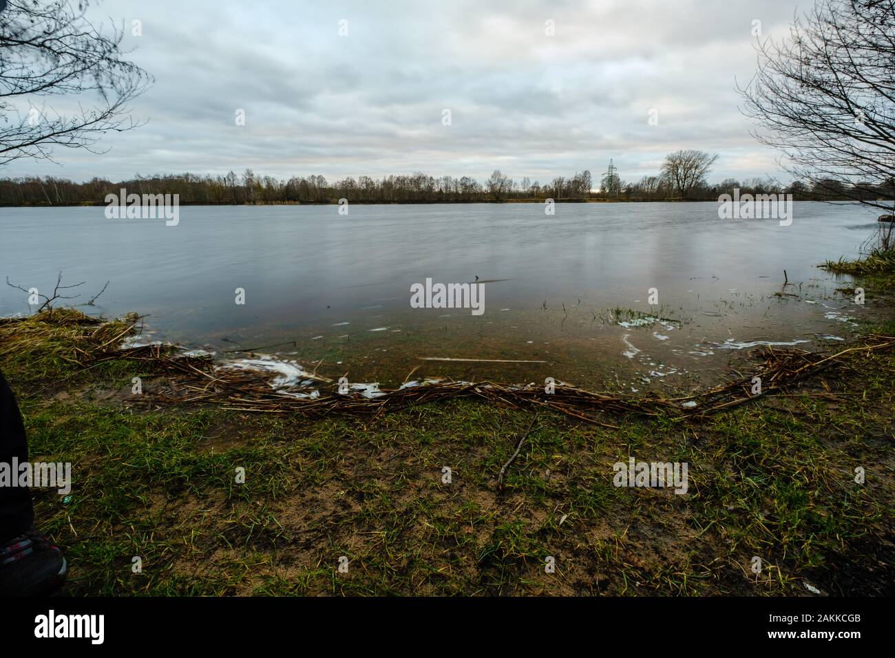 autumn river with flooded shore with trees in the water Stock Photo - Alamy