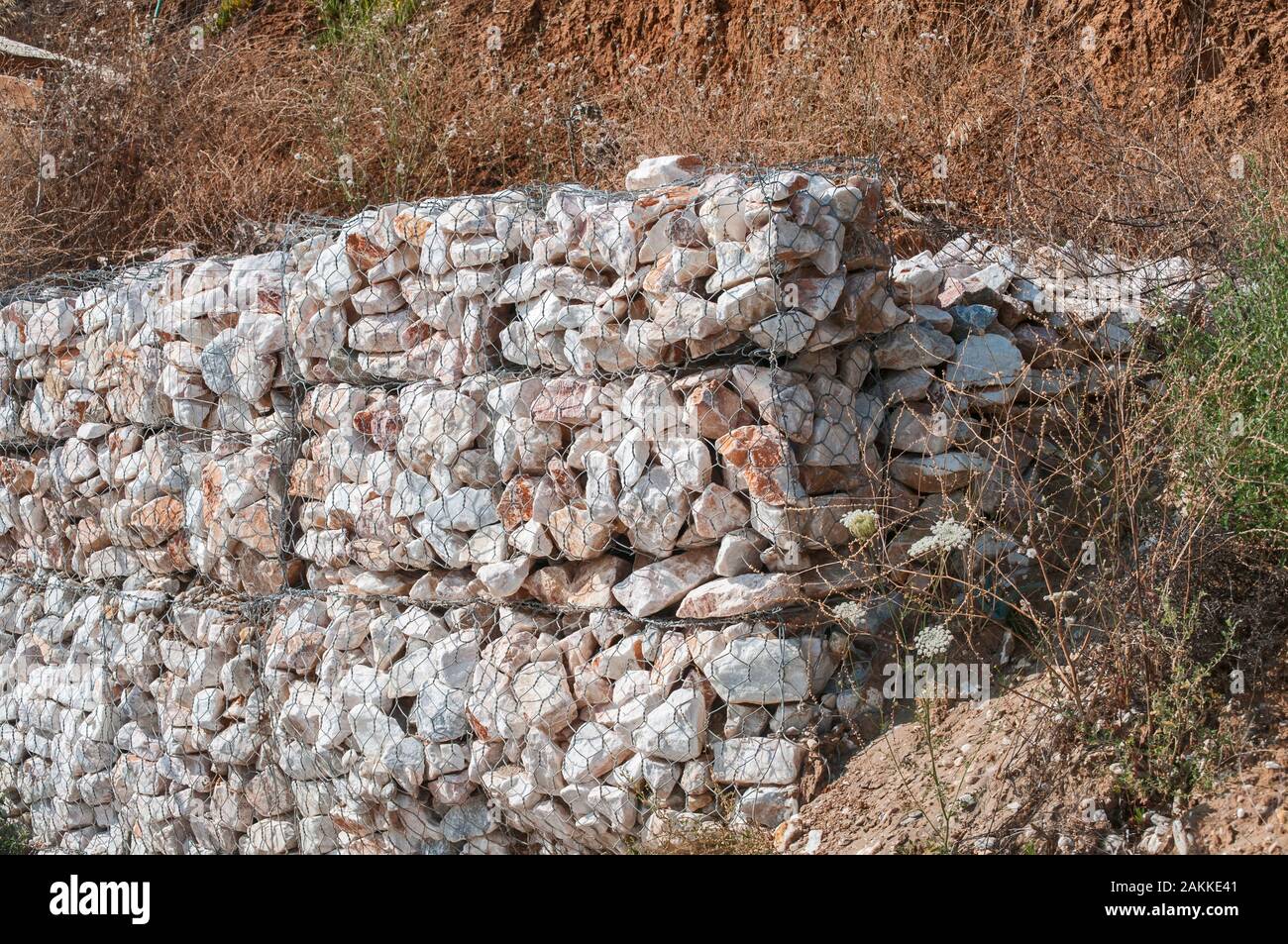 Gabion galvanized wire mesh box with stones on eroded seaside Stock ...