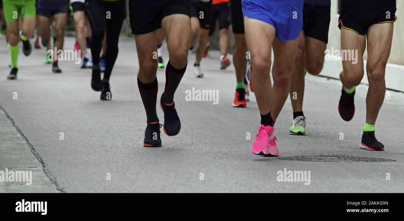 many legs of fast runners during a road marathon Stock Photo - Alamy