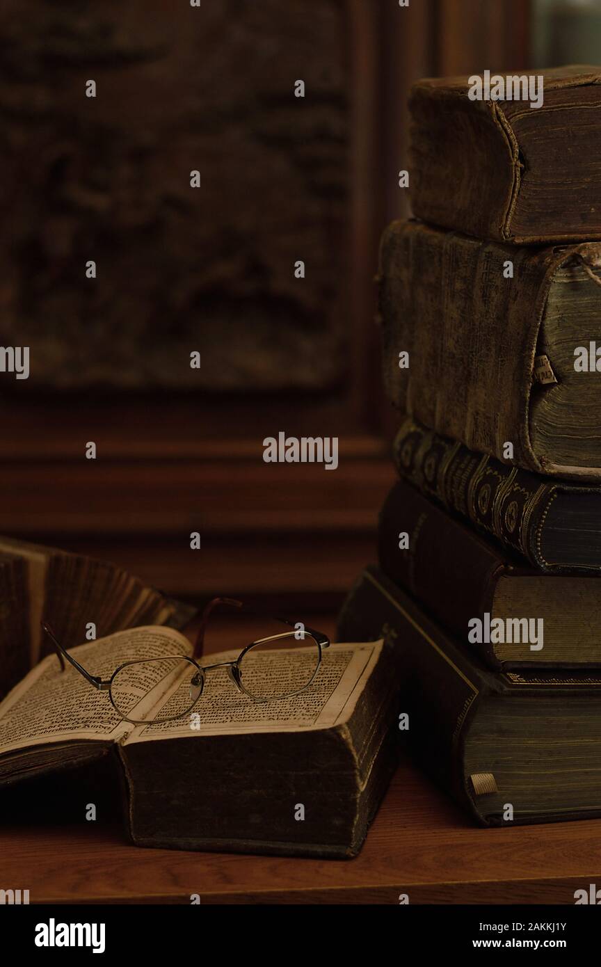 antique books with reading glasses Stock Photo - Alamy