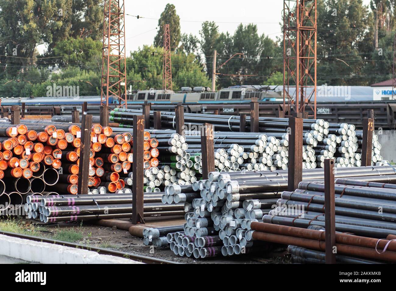 Metal rolling. Pipes folded in a railway warehouse are being prepared ...