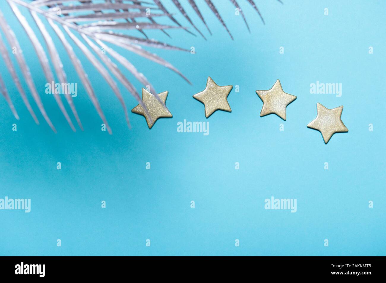 Four golden stars on blue background, top rating concept Stock Photo ...