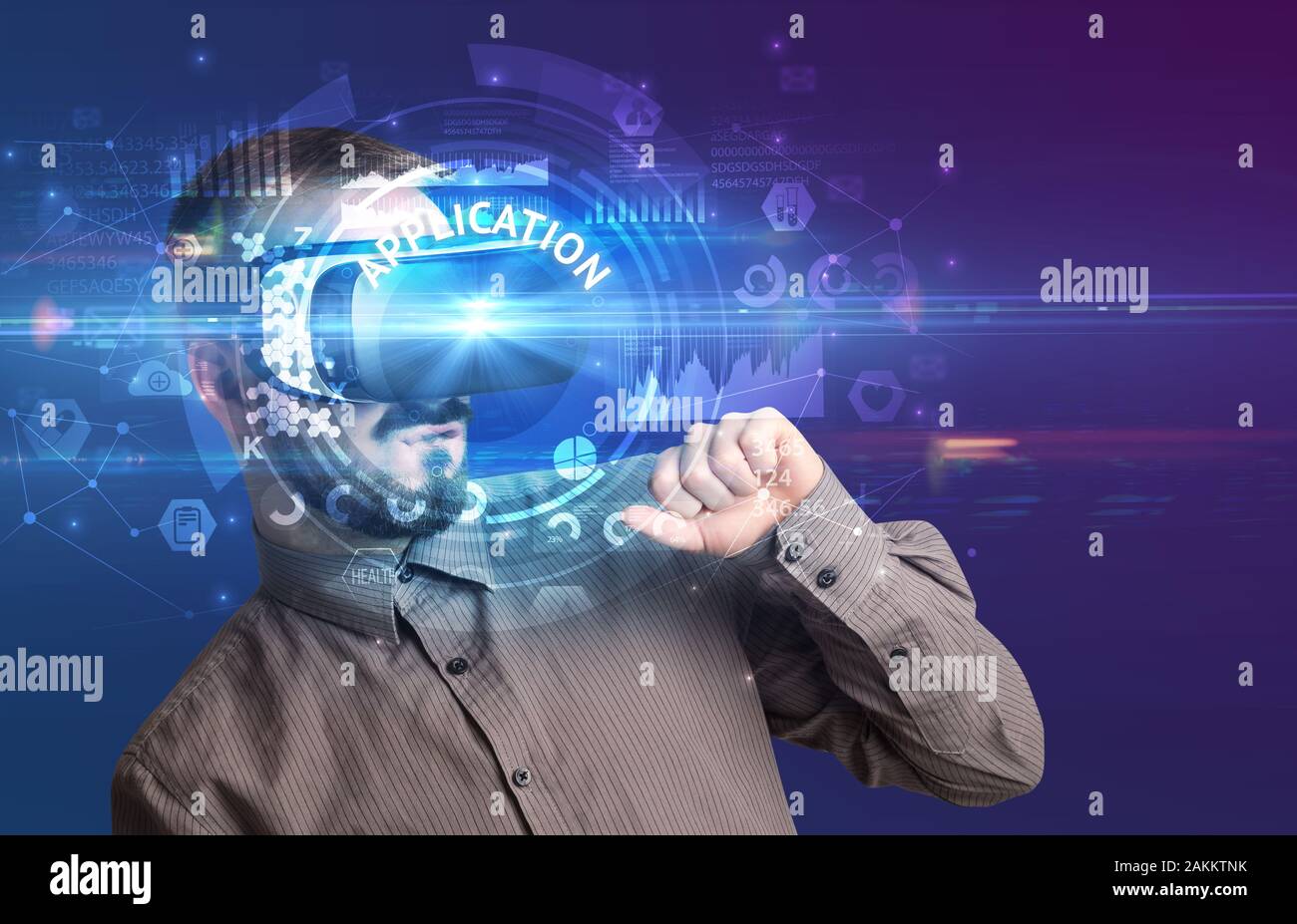 Businessman looking through Virtual Reality glasses with APPLICATION ...