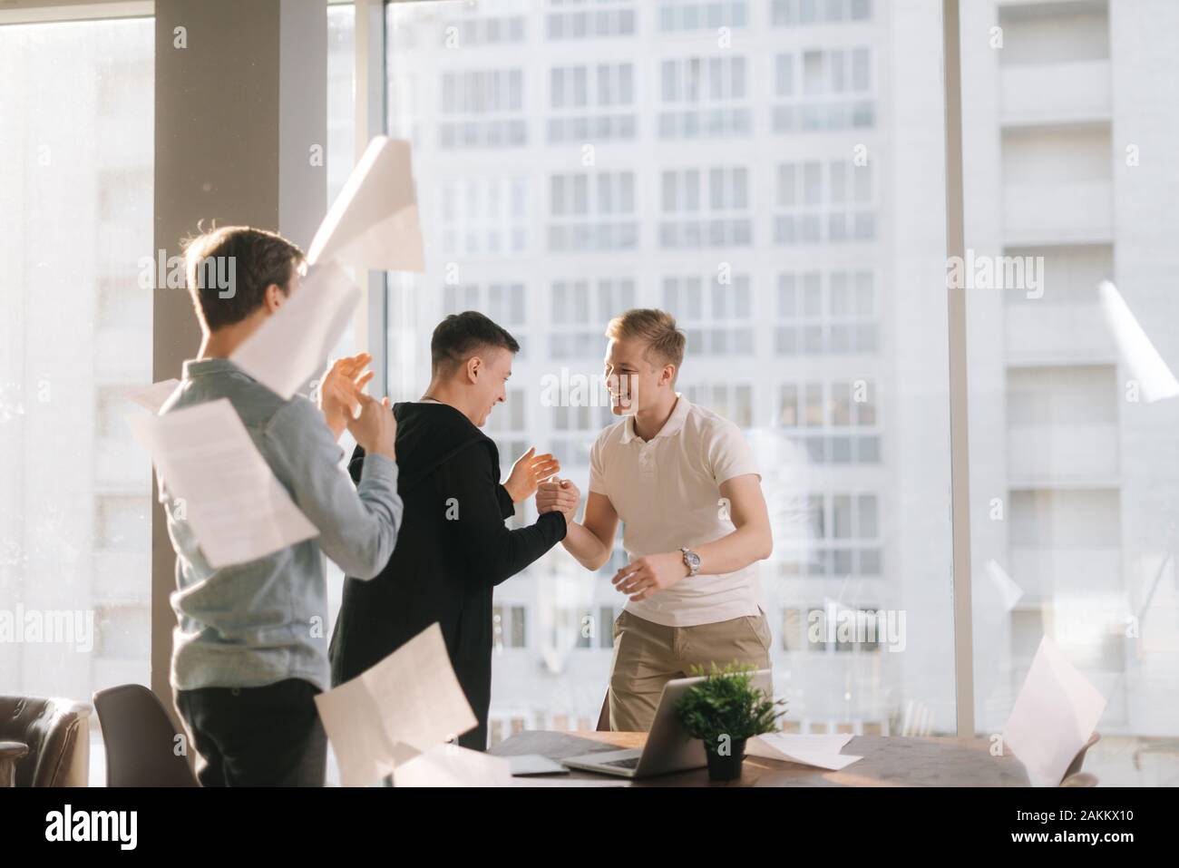 Successful business team are having fun throwing paper documents Stock ...