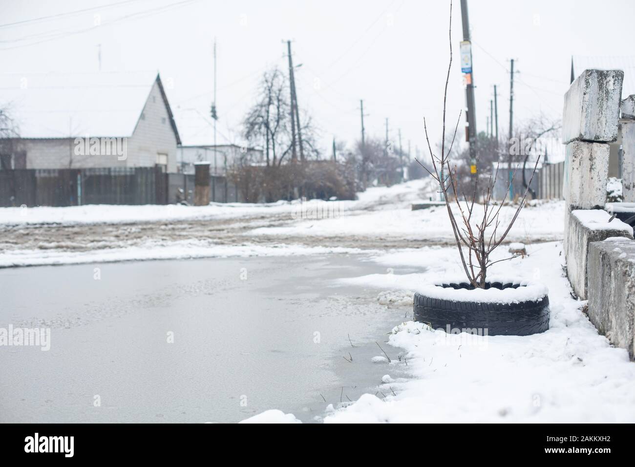 Street covered with snow. Winter in the city. Dirt and slush Stock ...