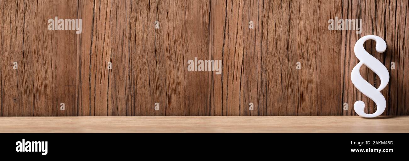 White Paragraph Symbol Leaning On Wooden Background Stock Photo - Alamy