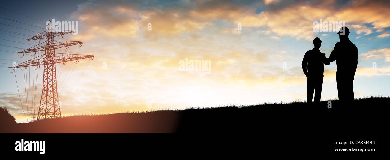 Silhouette Of Two Engineers Shaking Hands With Electricity Pylon ...