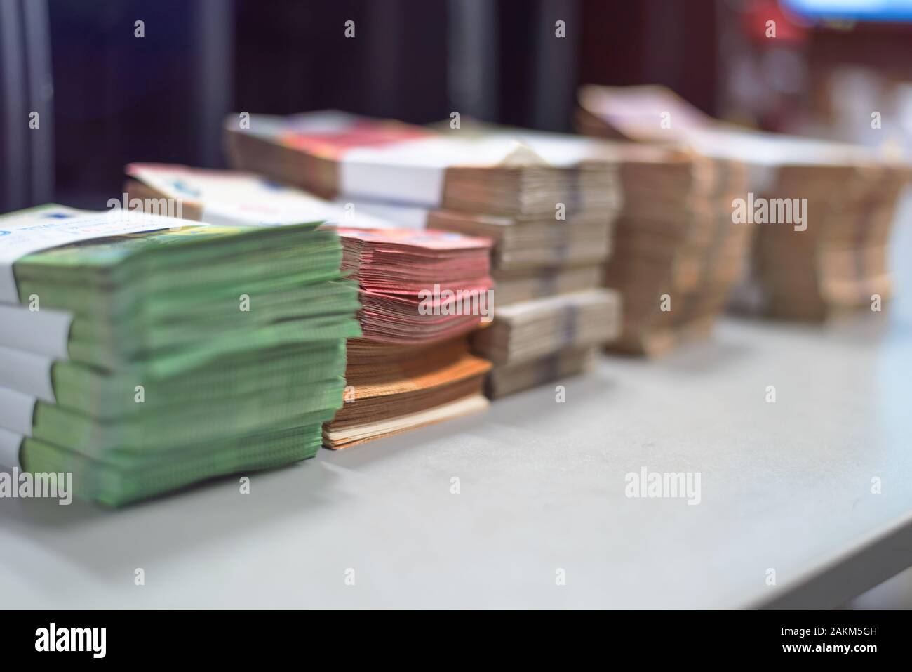Bundles of banknotes divided into groups with currency straps placed on ...