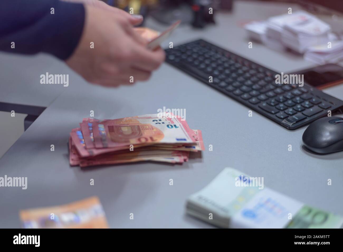 Bank employees sorting and counting money inside bank vault. Large ...
