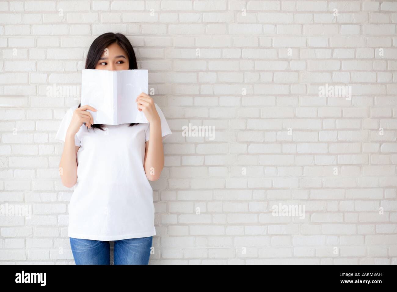 Hide behind open book hi-res stock photography and images - Alamy