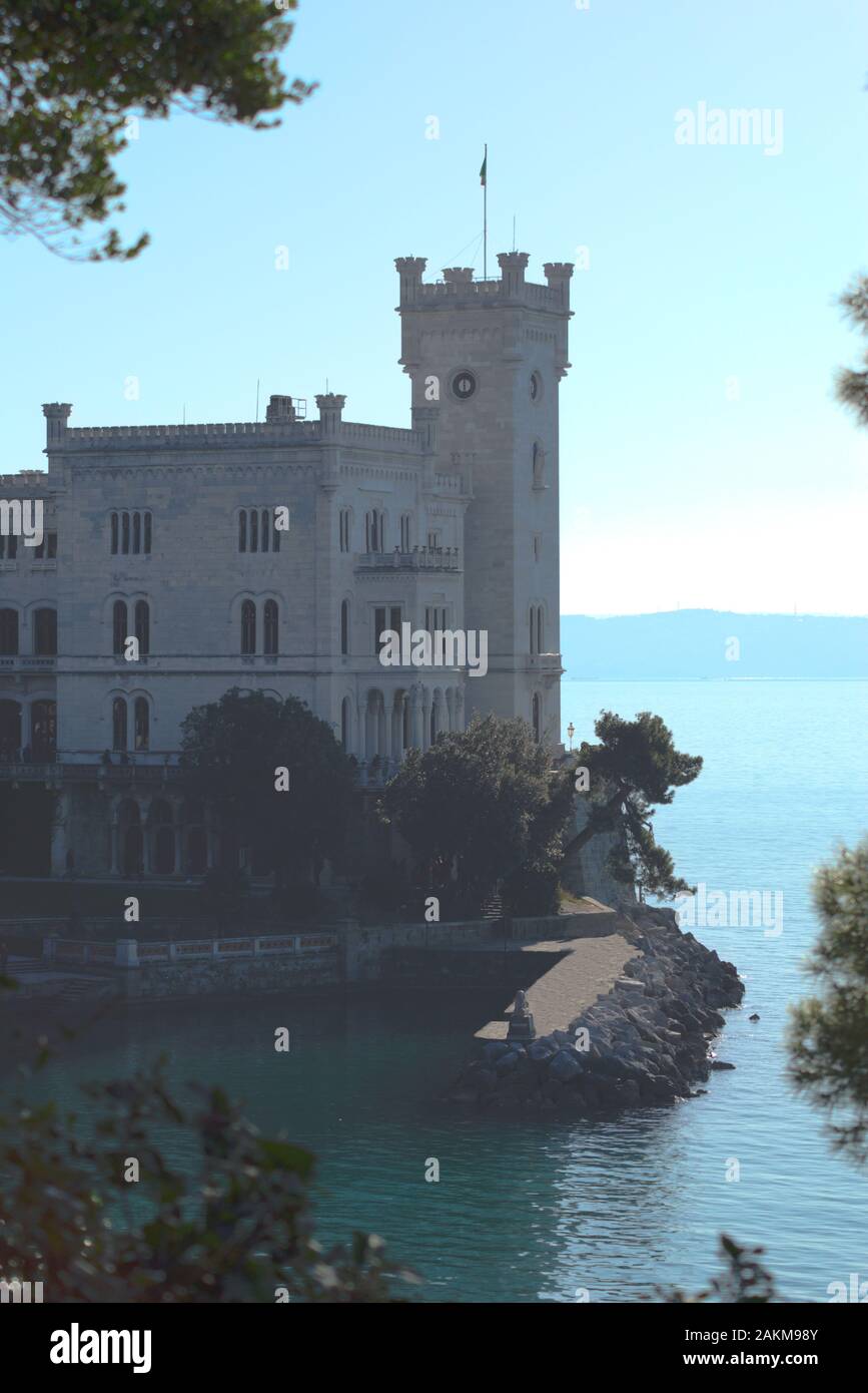 Castle overlooking the sea with a walk in the waves Stock Photo - Alamy