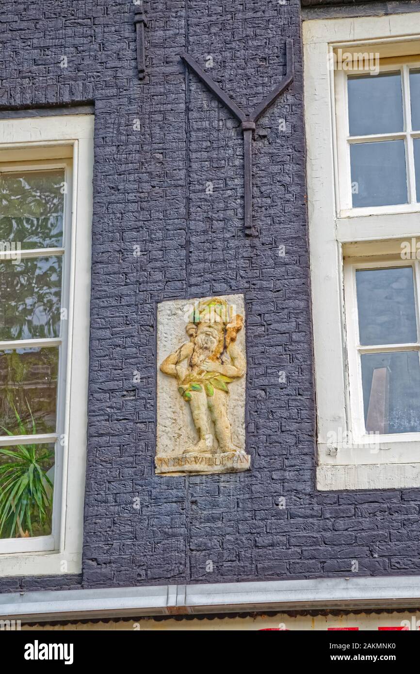 Amsterdam wall relief of the old house Stock Photo - Alamy