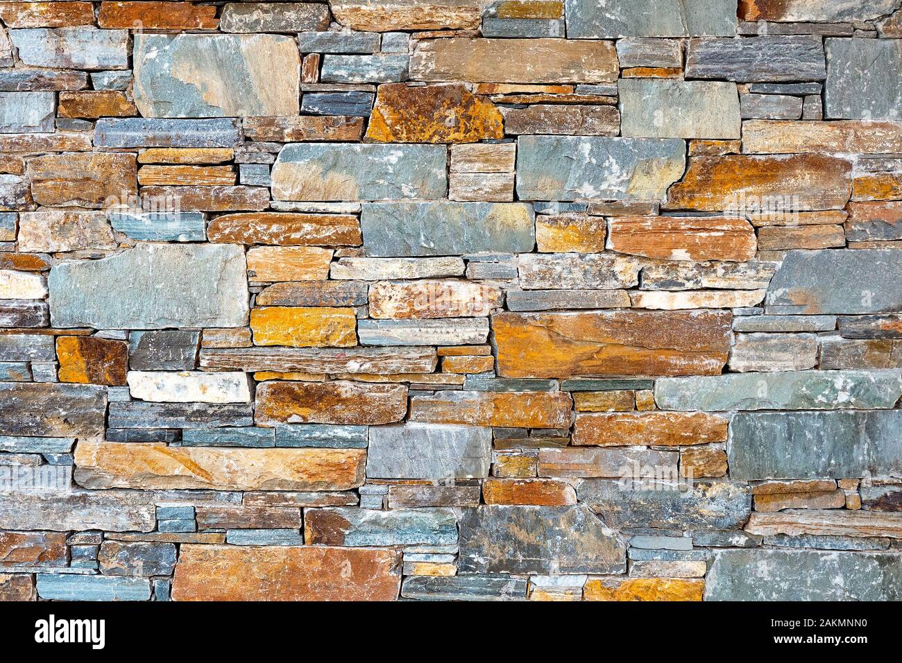 Surface with asymmetrical stones. Wall pattern texture background. Old ...