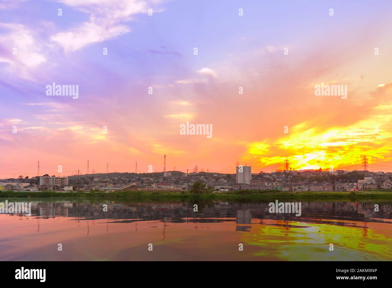 Beautiful sunset over village with reflection view Stock Photo - Alamy
