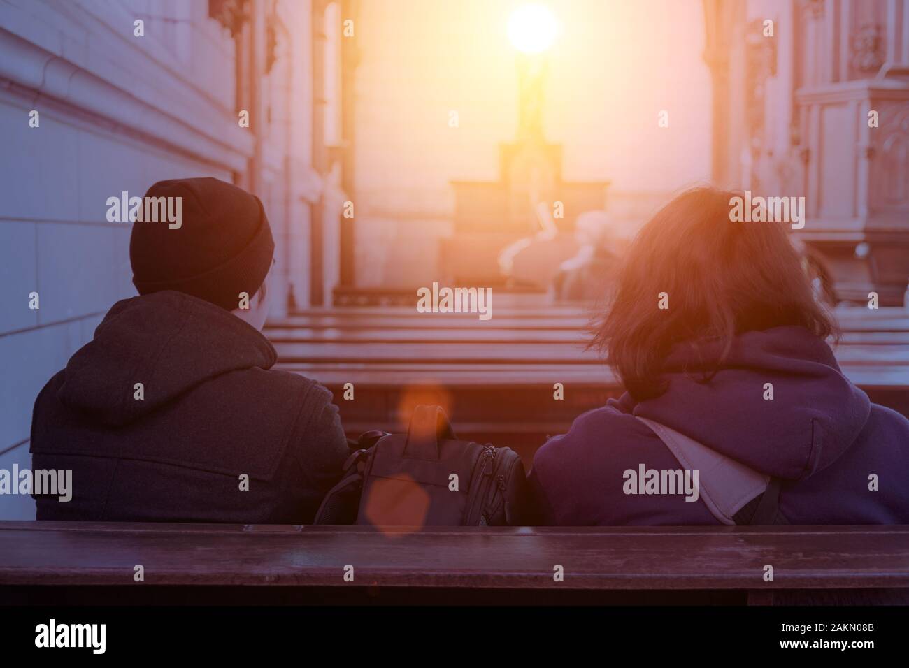 men in church interior with light Stock Photo - Alamy