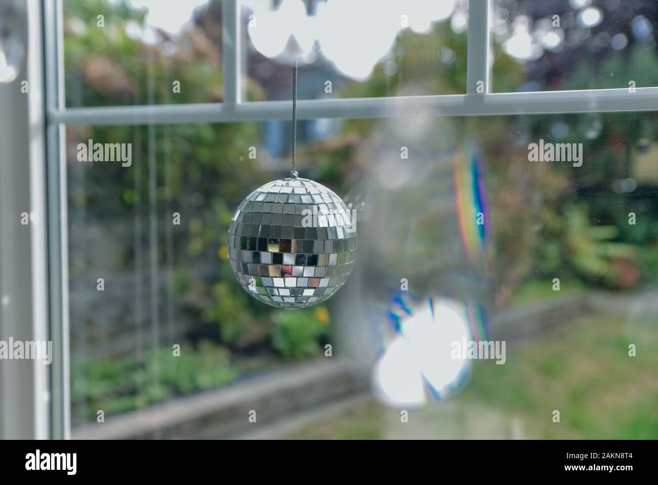 little disco ball sees by the window Stock Photo - Alamy