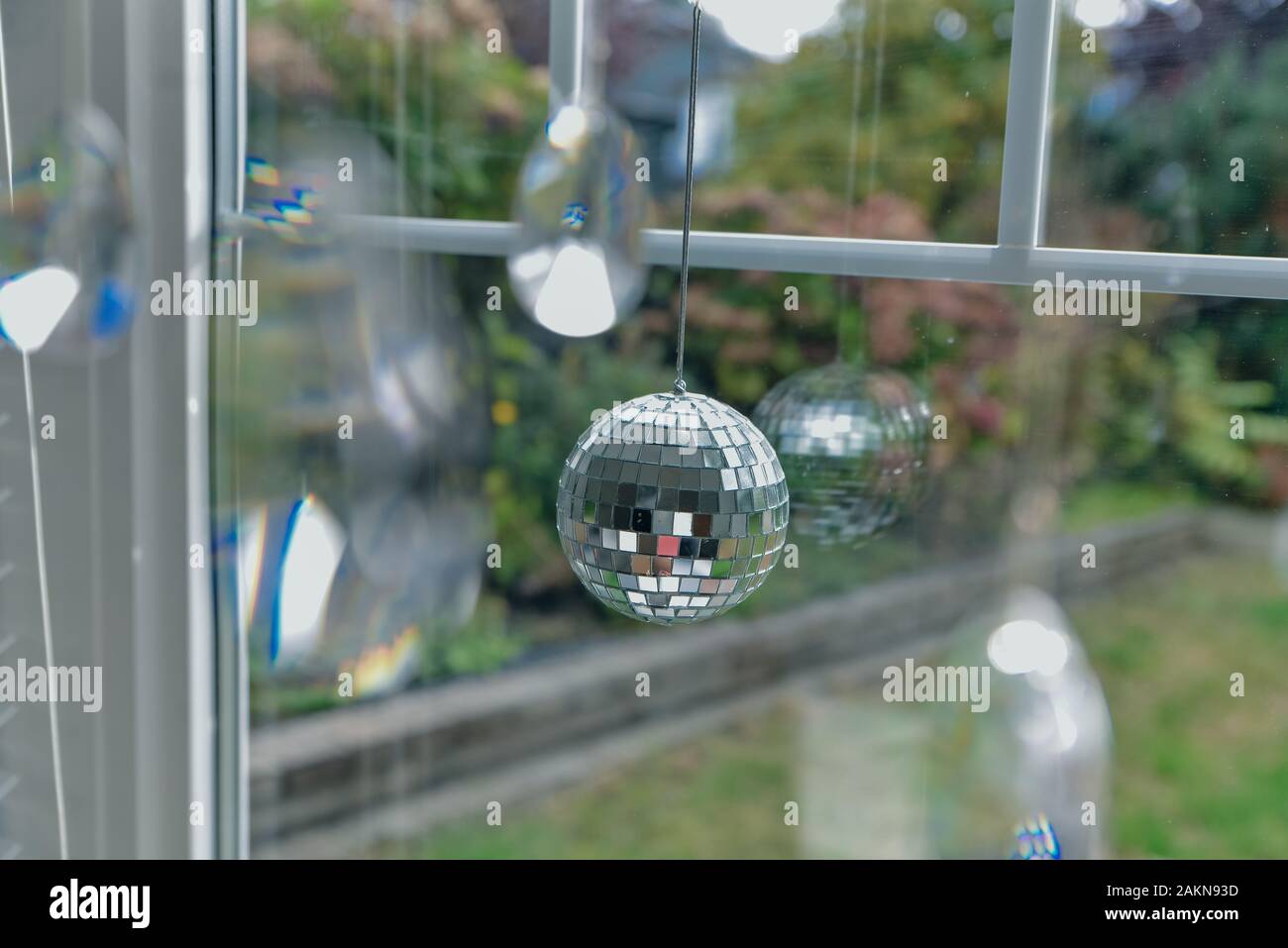 little disco ball sees by the window Stock Photo - Alamy