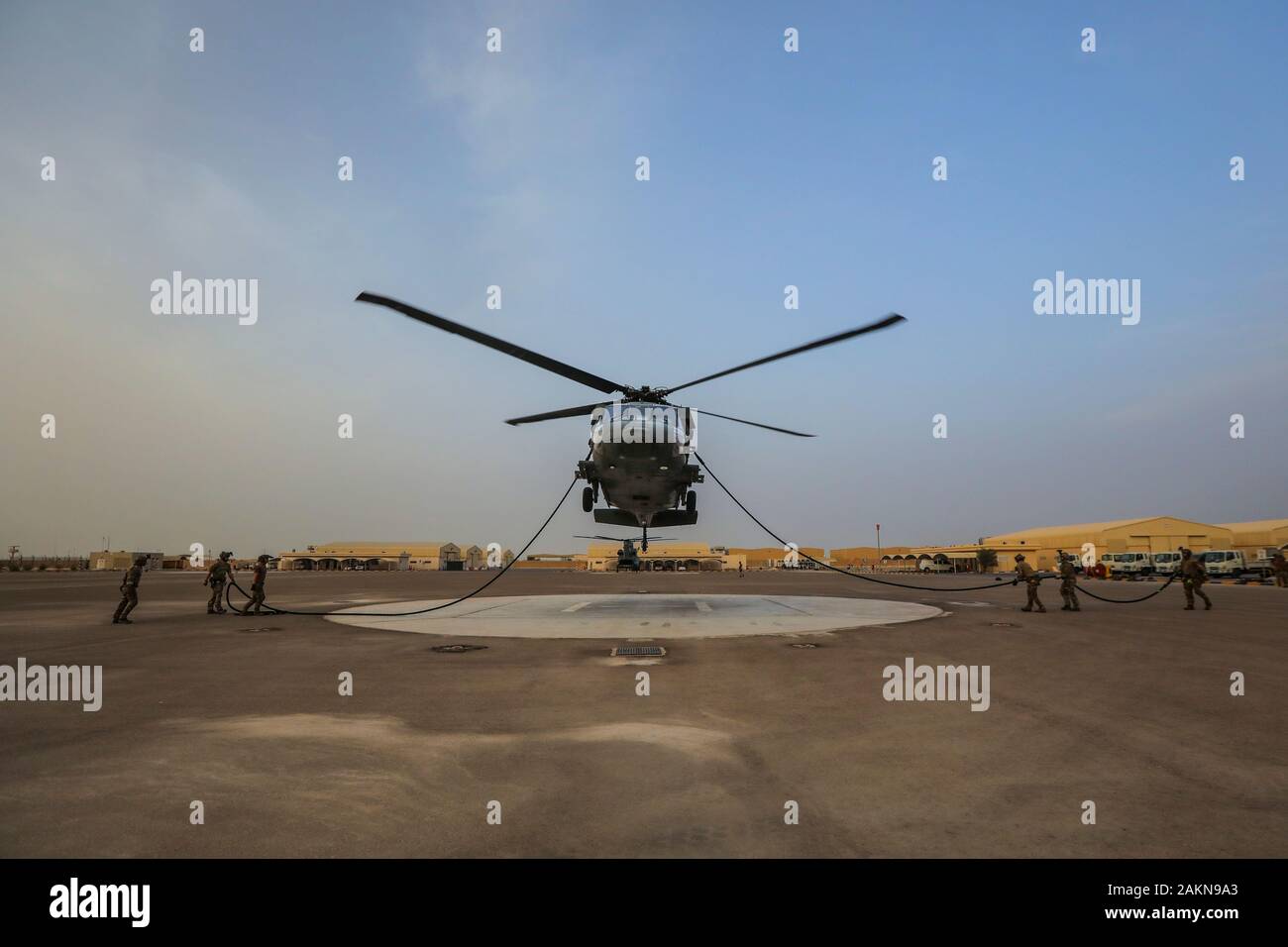 Soldiers with the 5th Special Forces Group (Airborne) pull on ropes ...