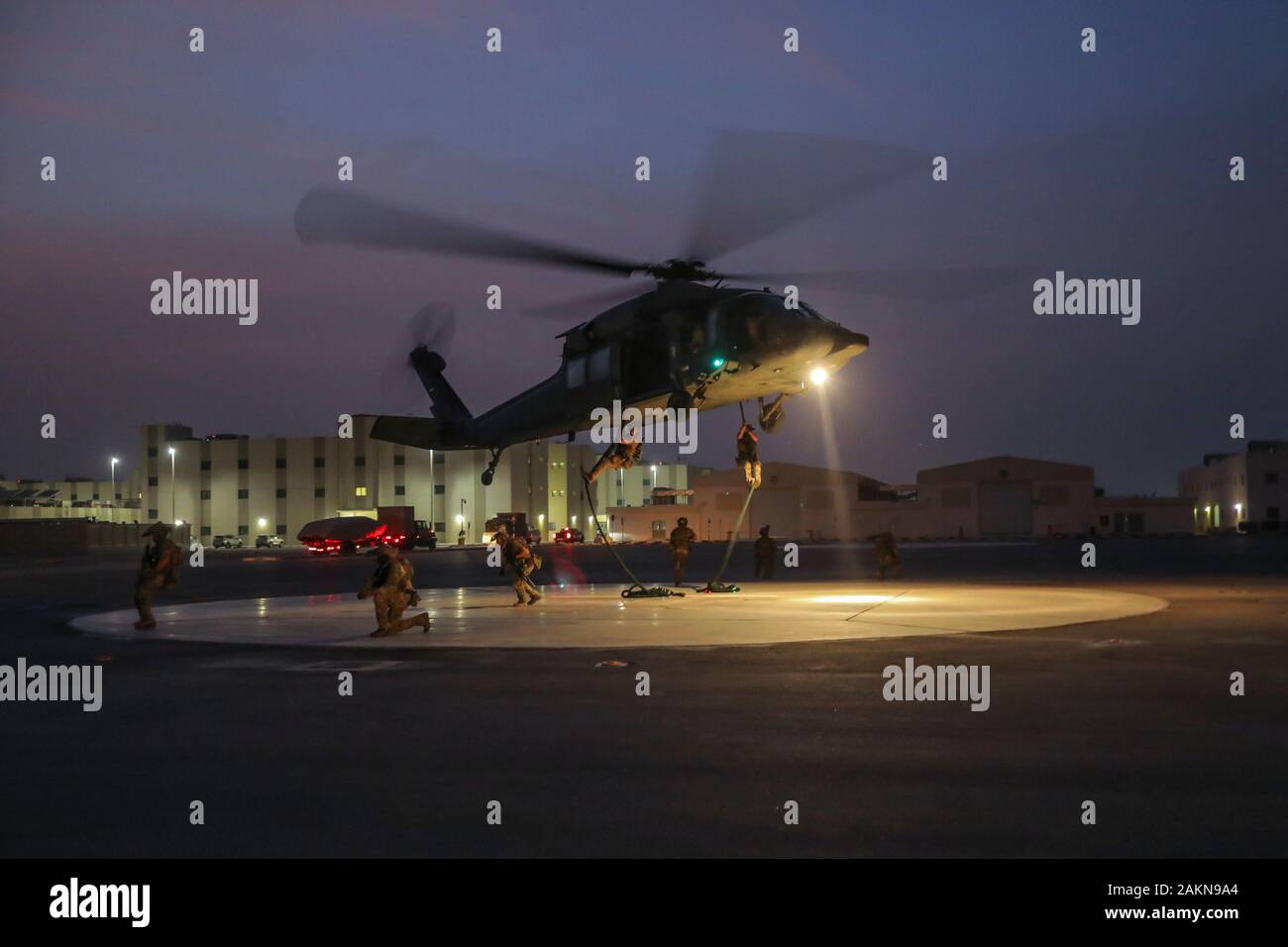 Two Soldiers with the 5th Special Forces Group (Airborne) slide down ...