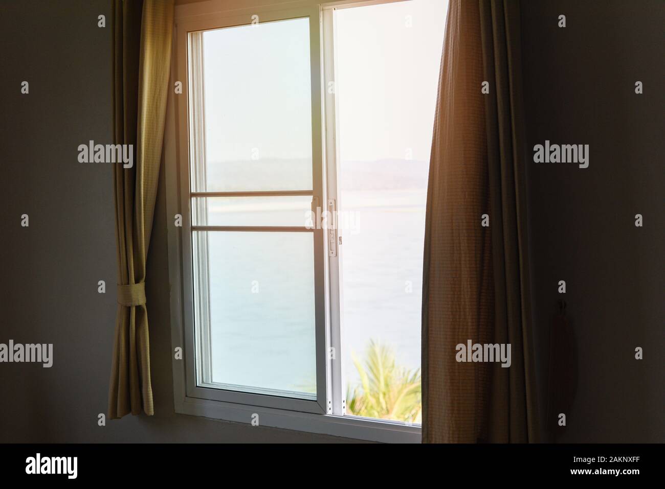 window view sea beach and mountains in the bed at bedroom morning and ...