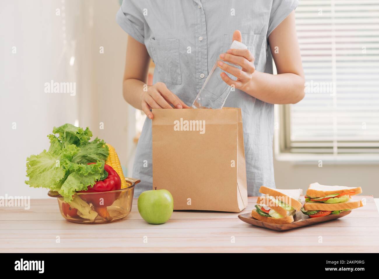 Mother cooking school lunch box set, Preparing healthy snacks - cheese ...