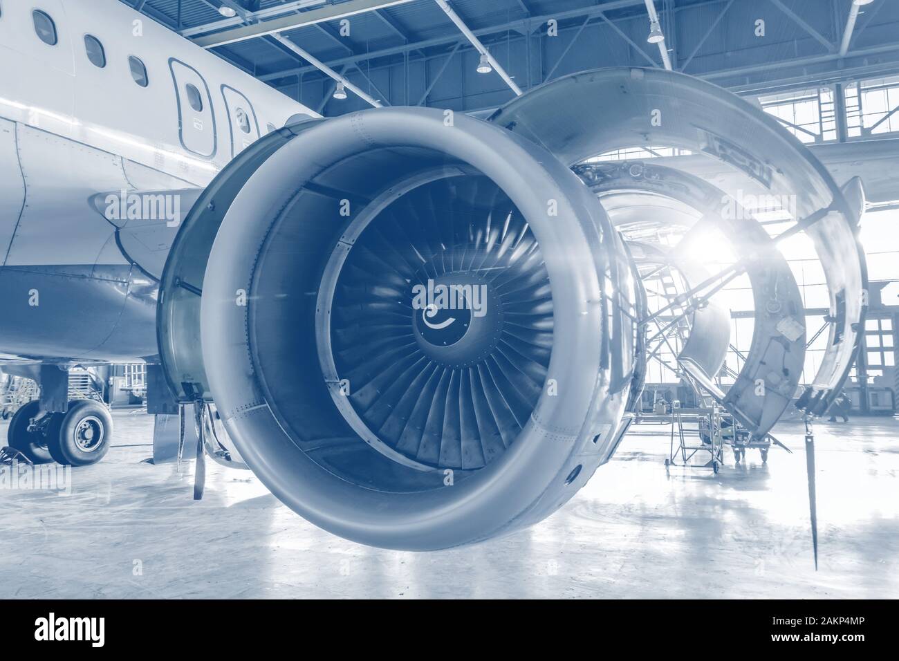 Engine of the airplane under heavy maintenance, open hood Stock Photo ...