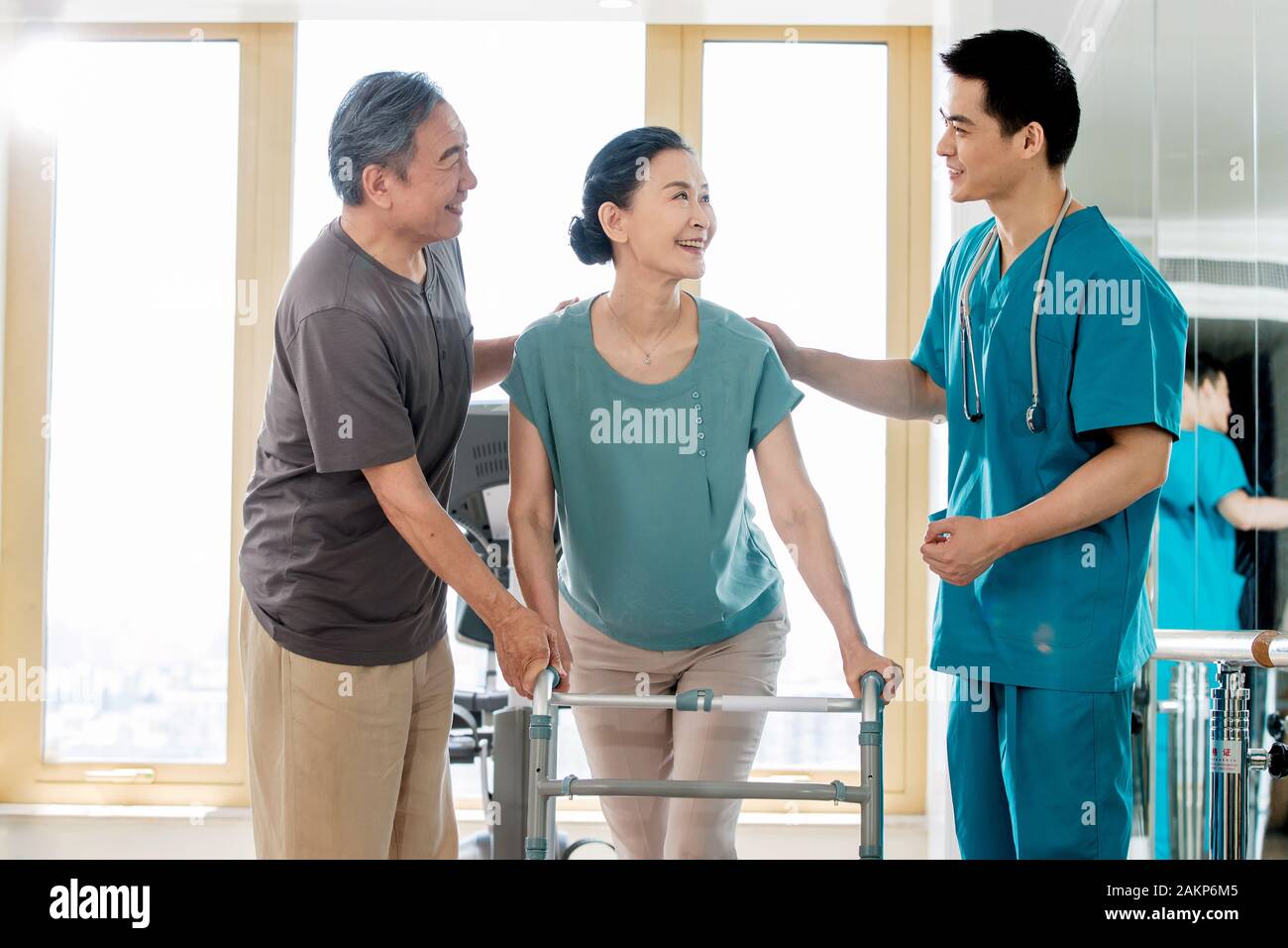 Doctors to help the patients' rehabilitation exercise Stock Photo - Alamy