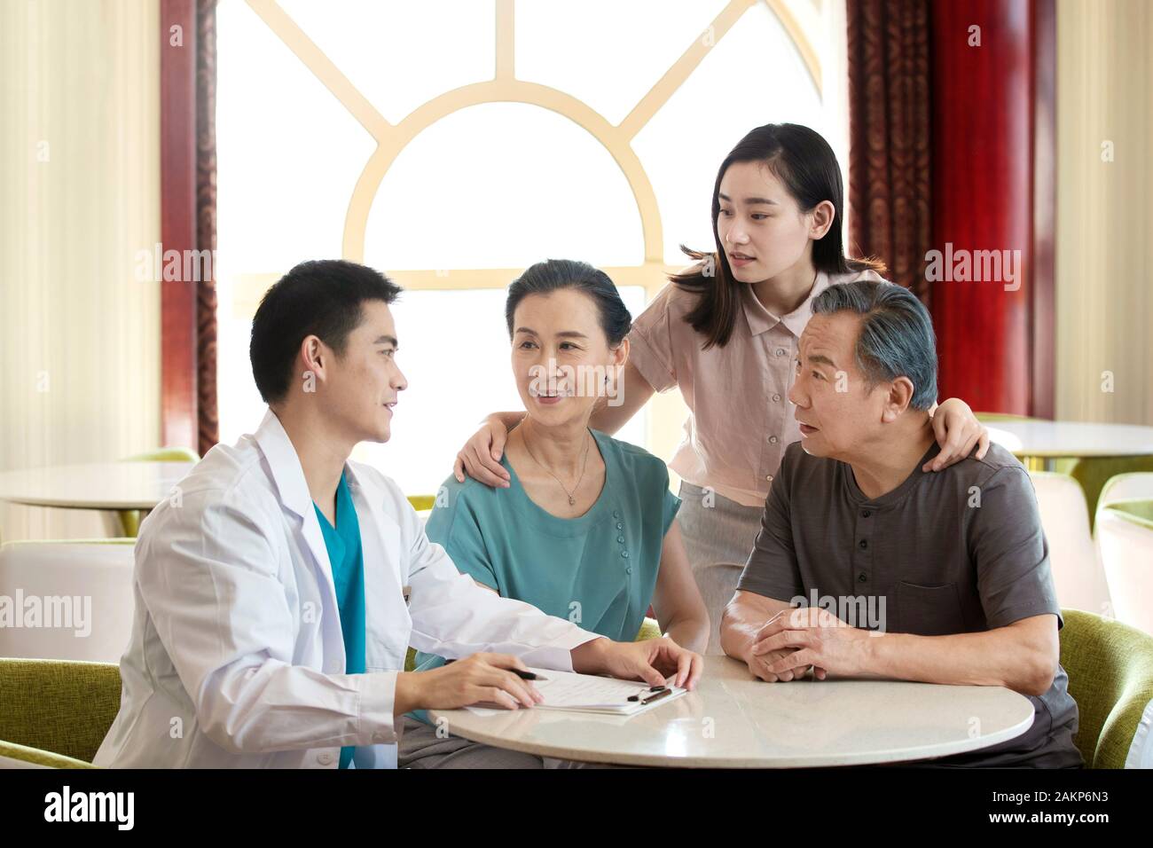 Doctor with senior patients family hi-res stock photography and images ...