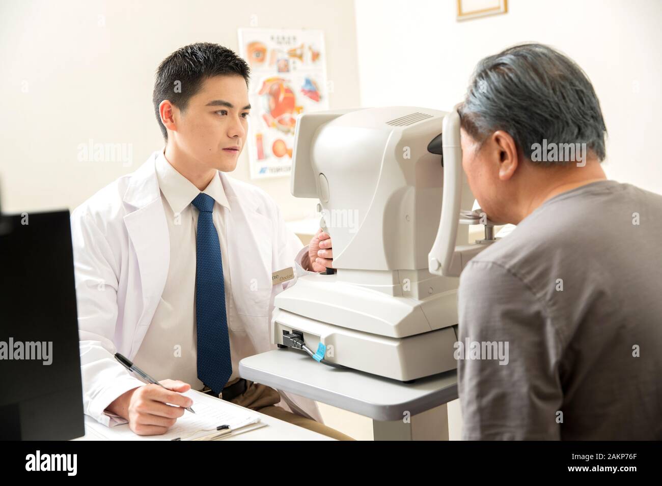 Doctors give patients eyes checked Stock Photo - Alamy