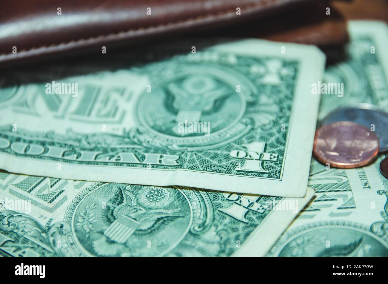 close up of dollar bill and coin on pocket Stock Photo - Alamy