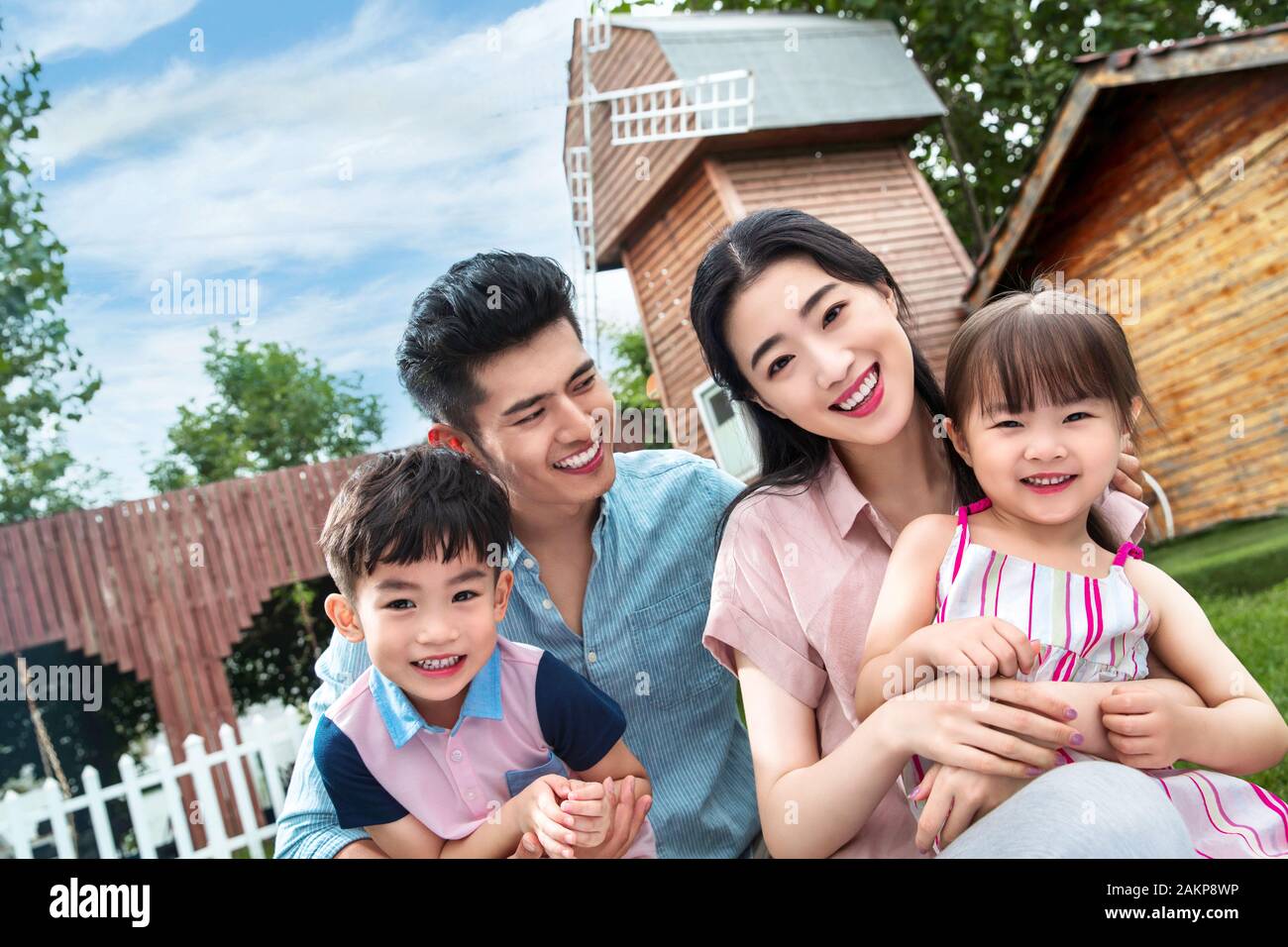 Happiness of a family of four Stock Photo - Alamy