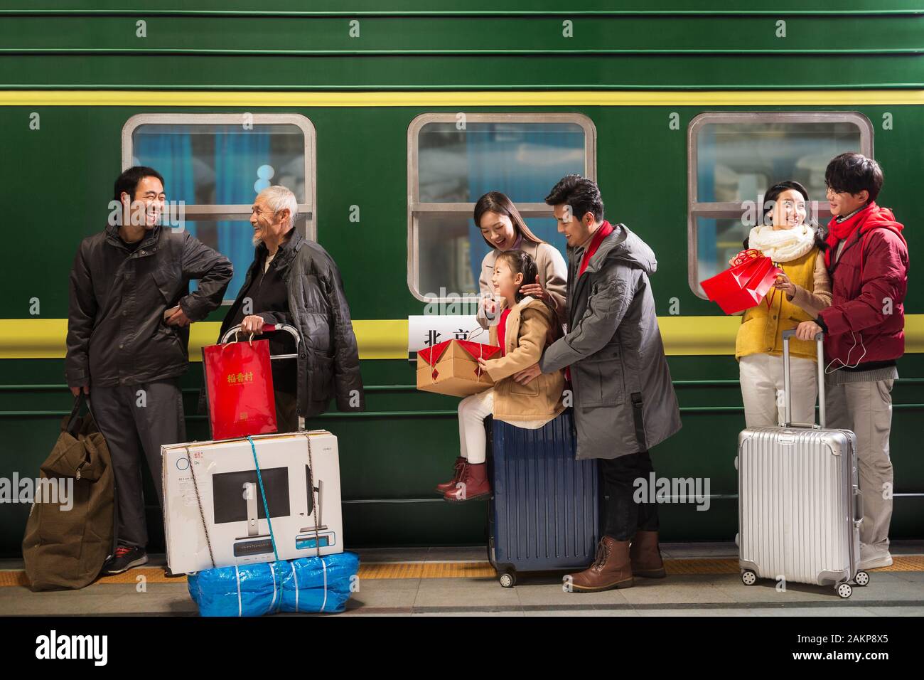 Standing on the platform the train passengers queuing for buses Stock ...