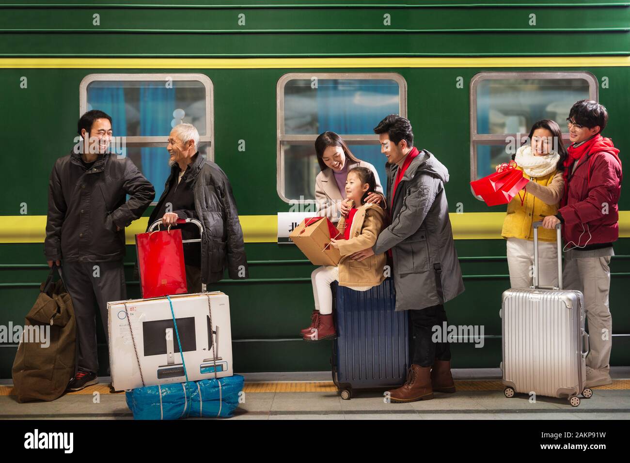 Standing on the platform the train passengers queuing for buses Stock ...