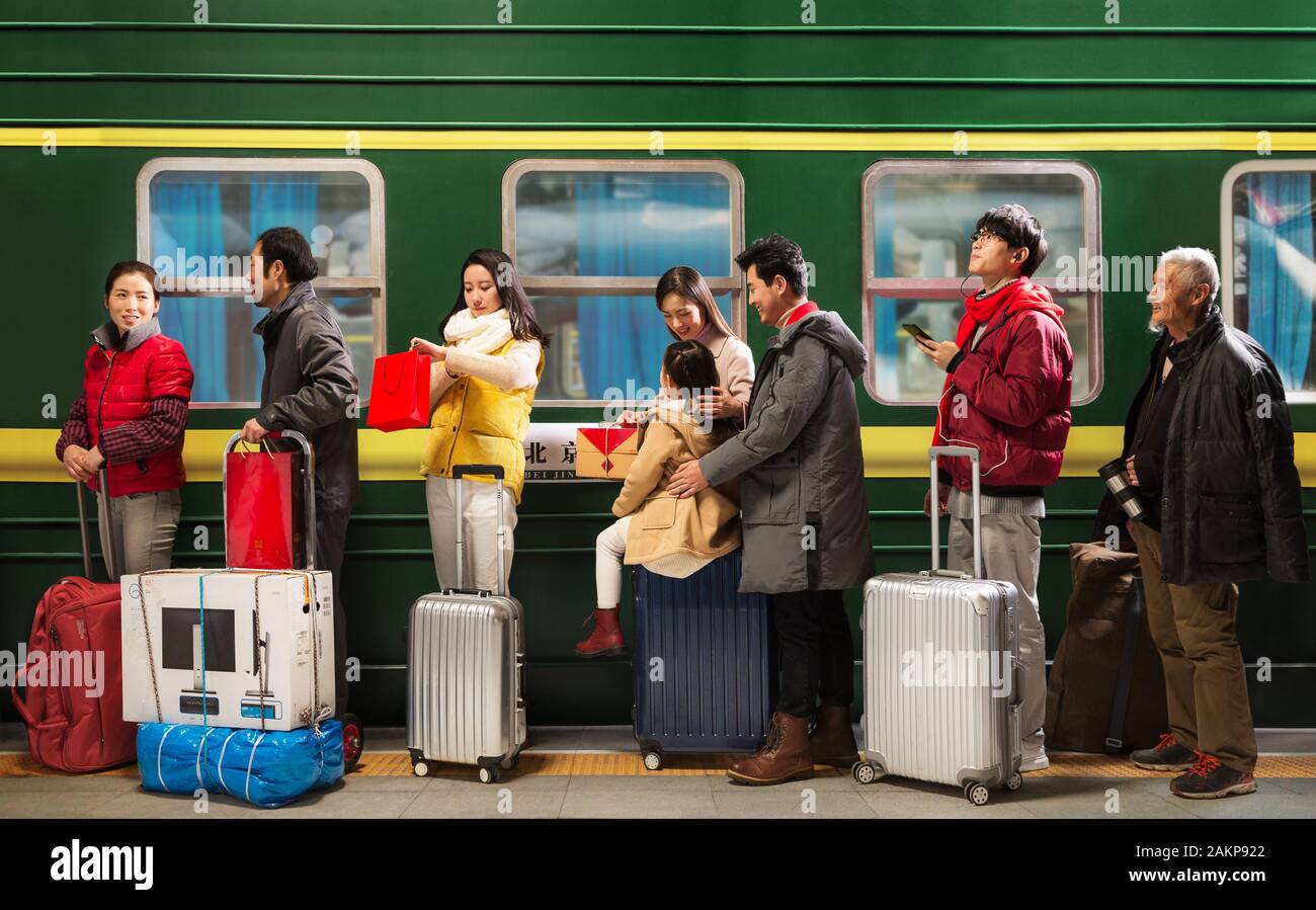 Standing on the platform the train passengers queuing for buses Stock ...