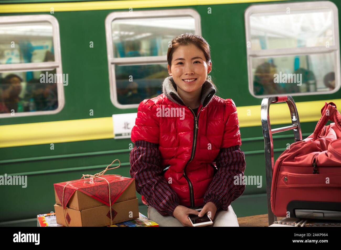 The woman on the stage at the railway station Stock Photo - Alamy
