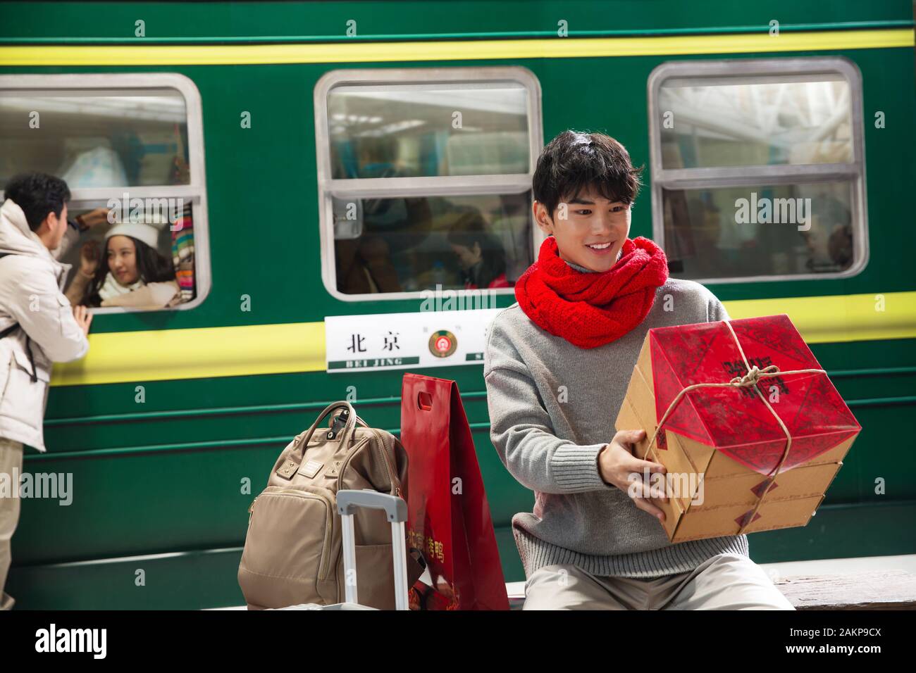 The stage of passengers at the railway station Stock Photo - Alamy