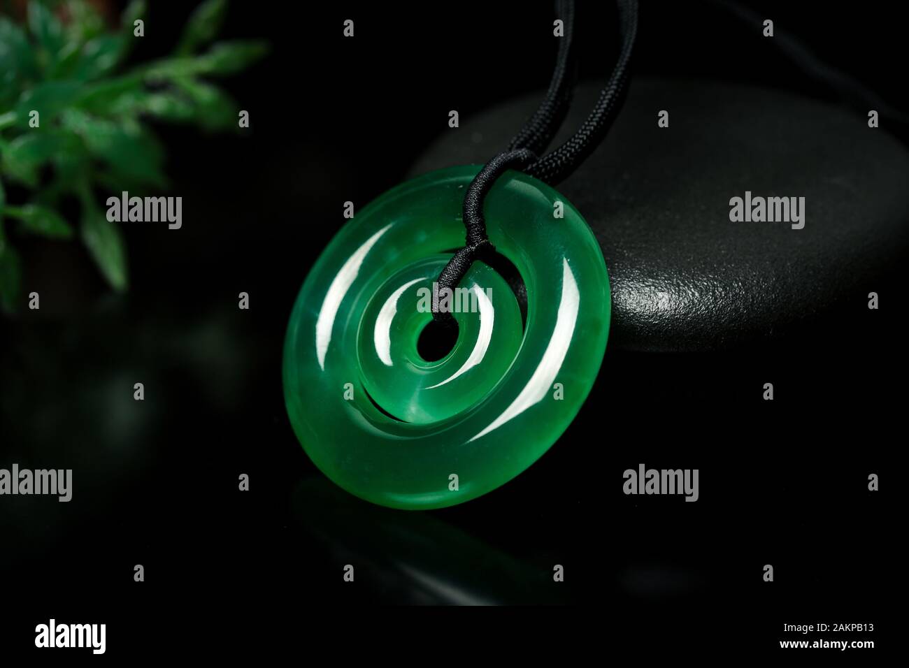 Round jade pendant features Stock Photo - Alamy