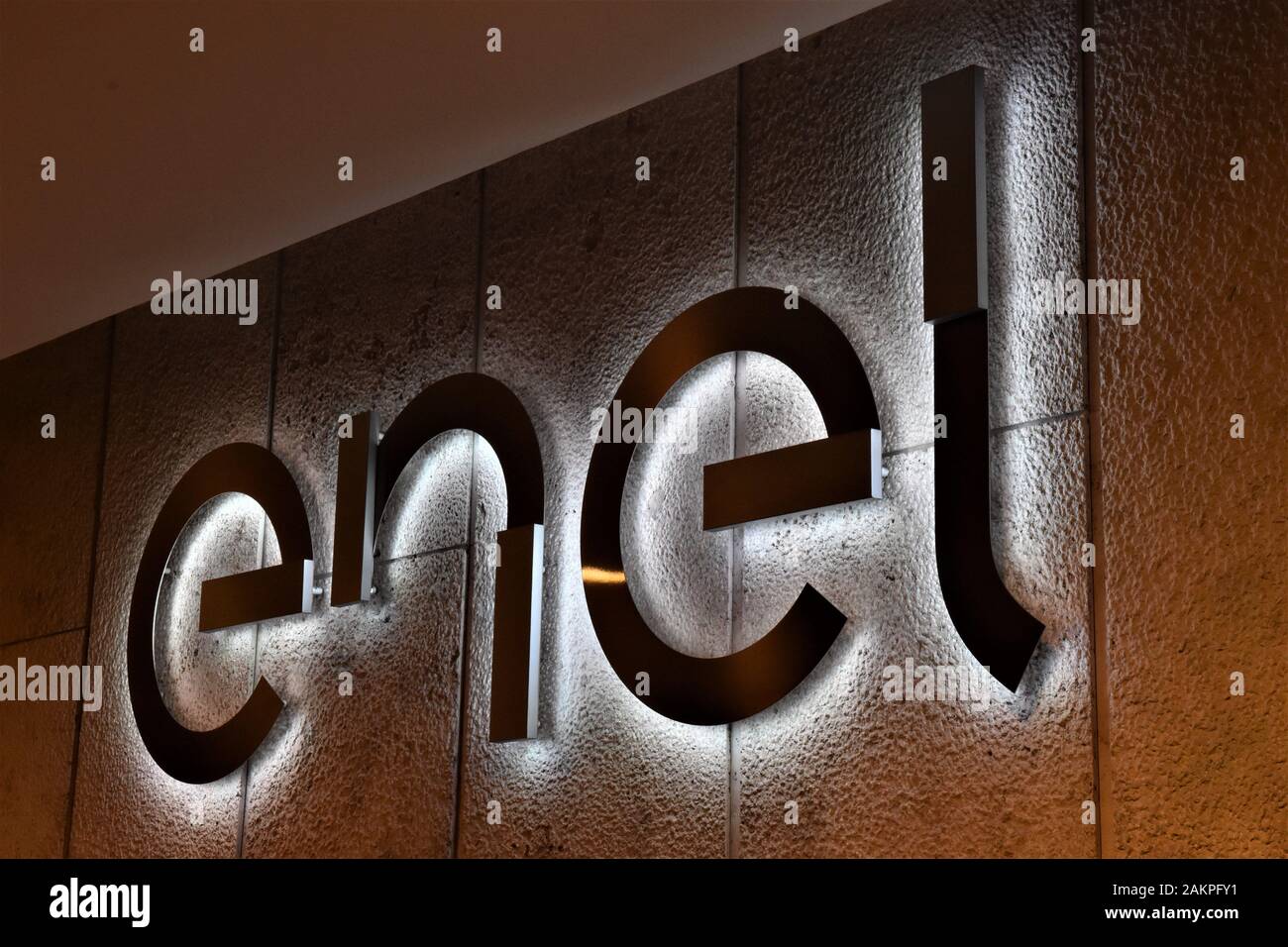ENEL LOGO ON THE WALL IN THE NIGHT.ENEL IS AN ITALIAN ENERGY COMPANY ...