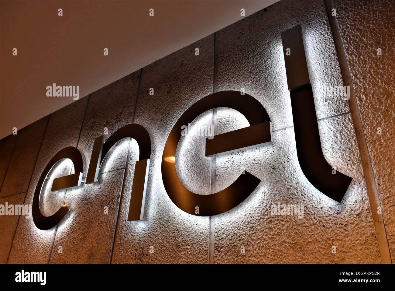 ENEL LOGO ON THE WALL IN THE NIGHT.ENEL IS AN ITALIAN ENERGY COMPANY ...