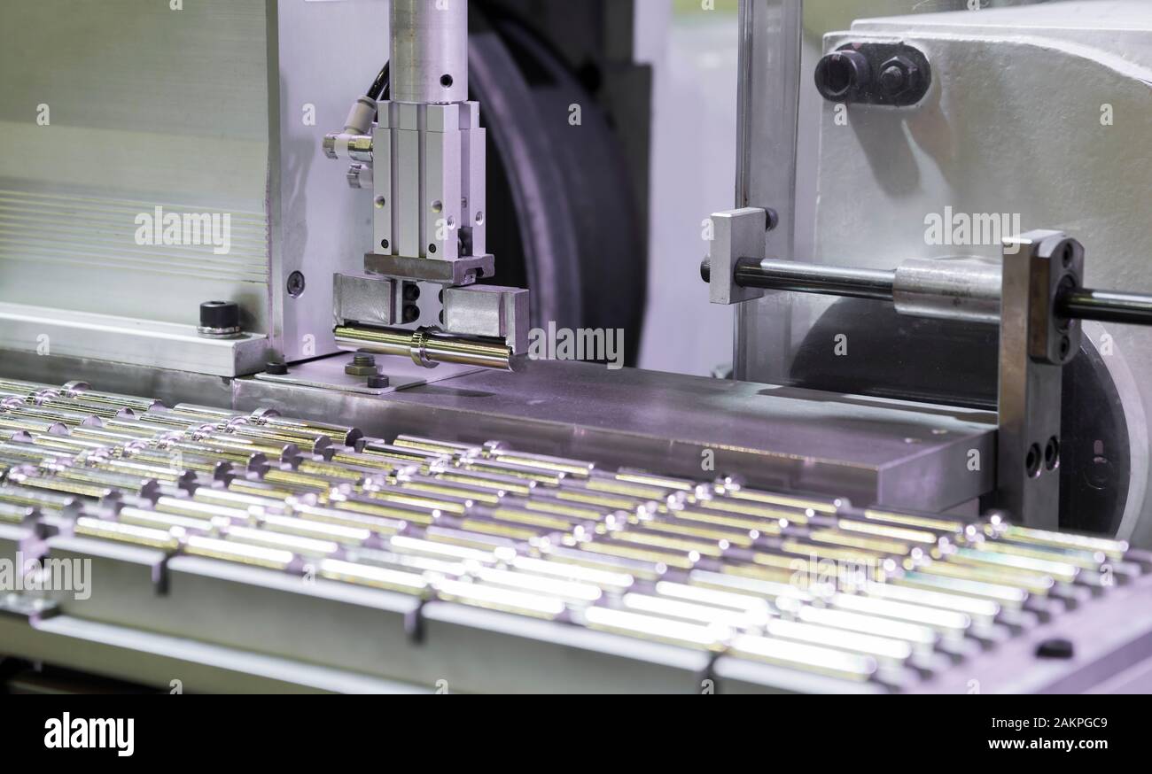 Robot arm pick small machined parts to next manufacturing process ...