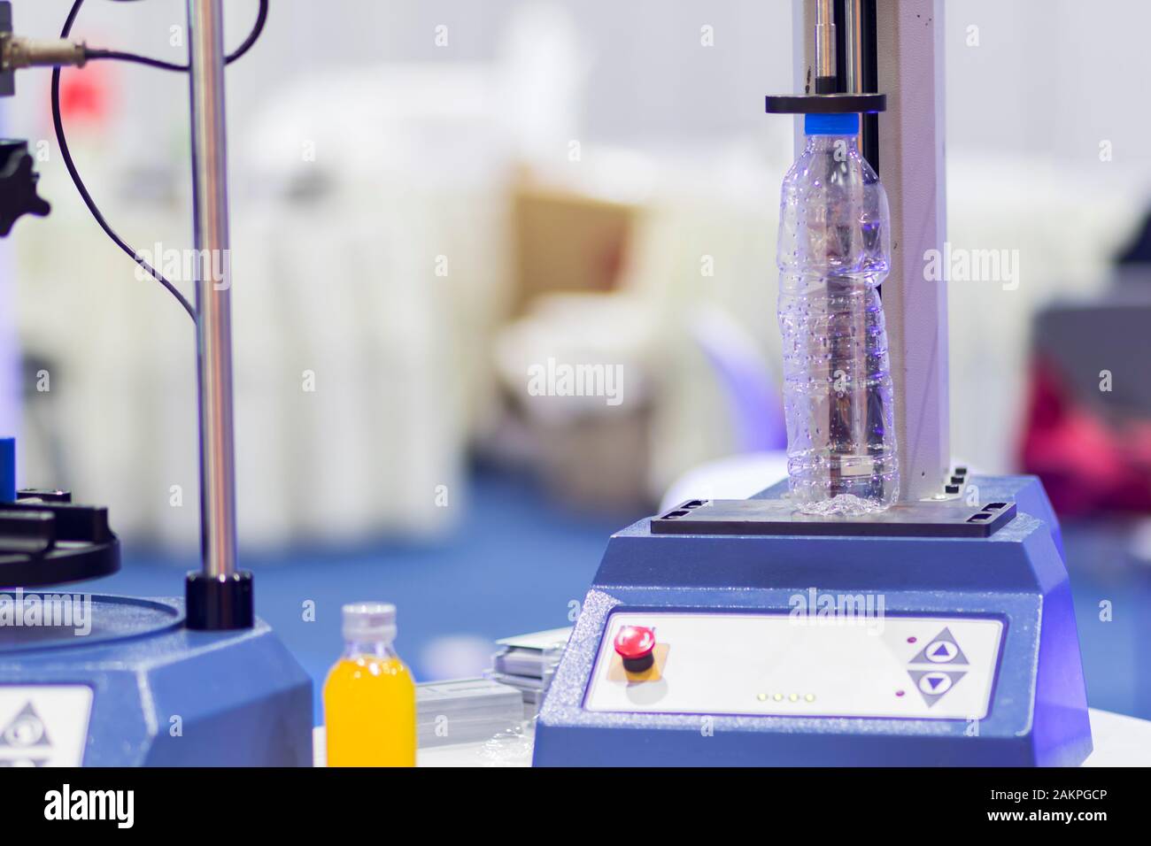 drinking bottle PE bottle is tested by compressive tensile testing ...